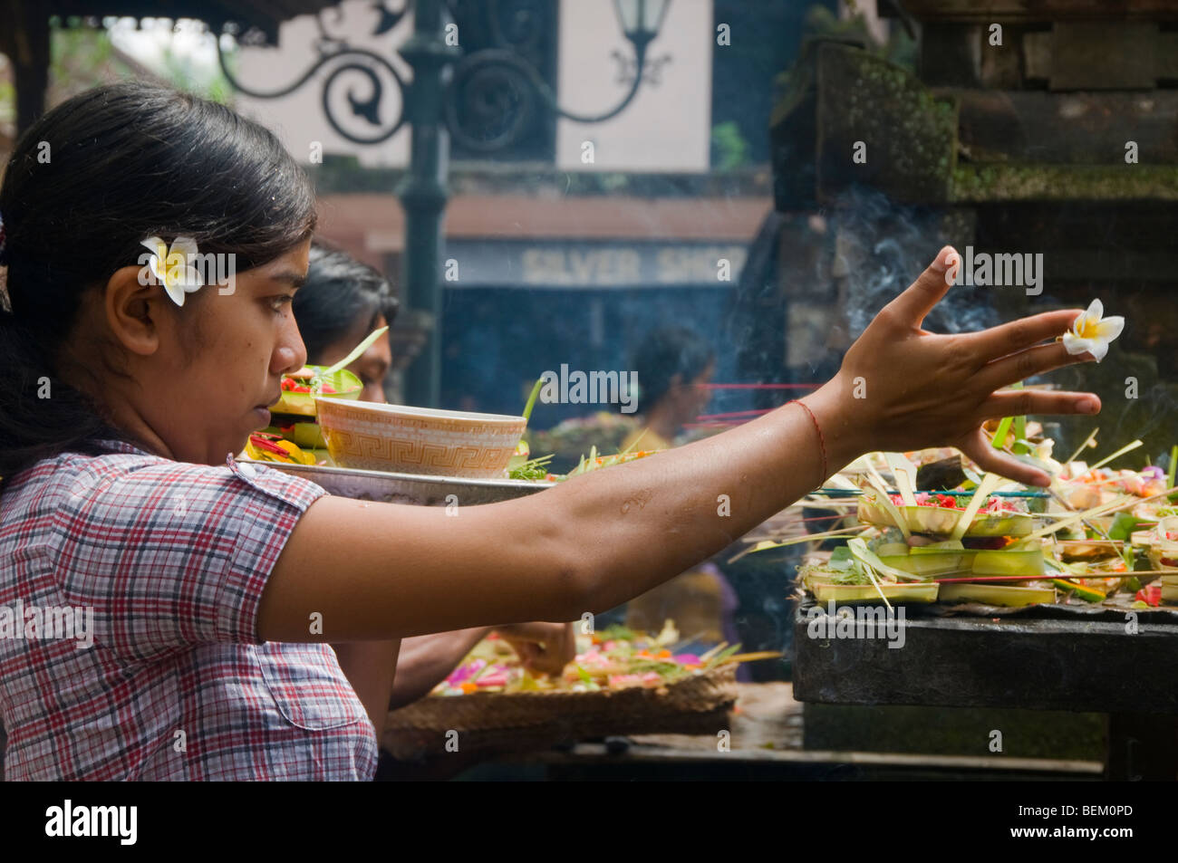 offering being made at a temple in Ubud in Bali Indonesia Stock Photo ...