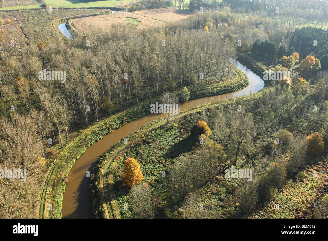 Fields, grasslands and forested area along river Demer from the air in ...