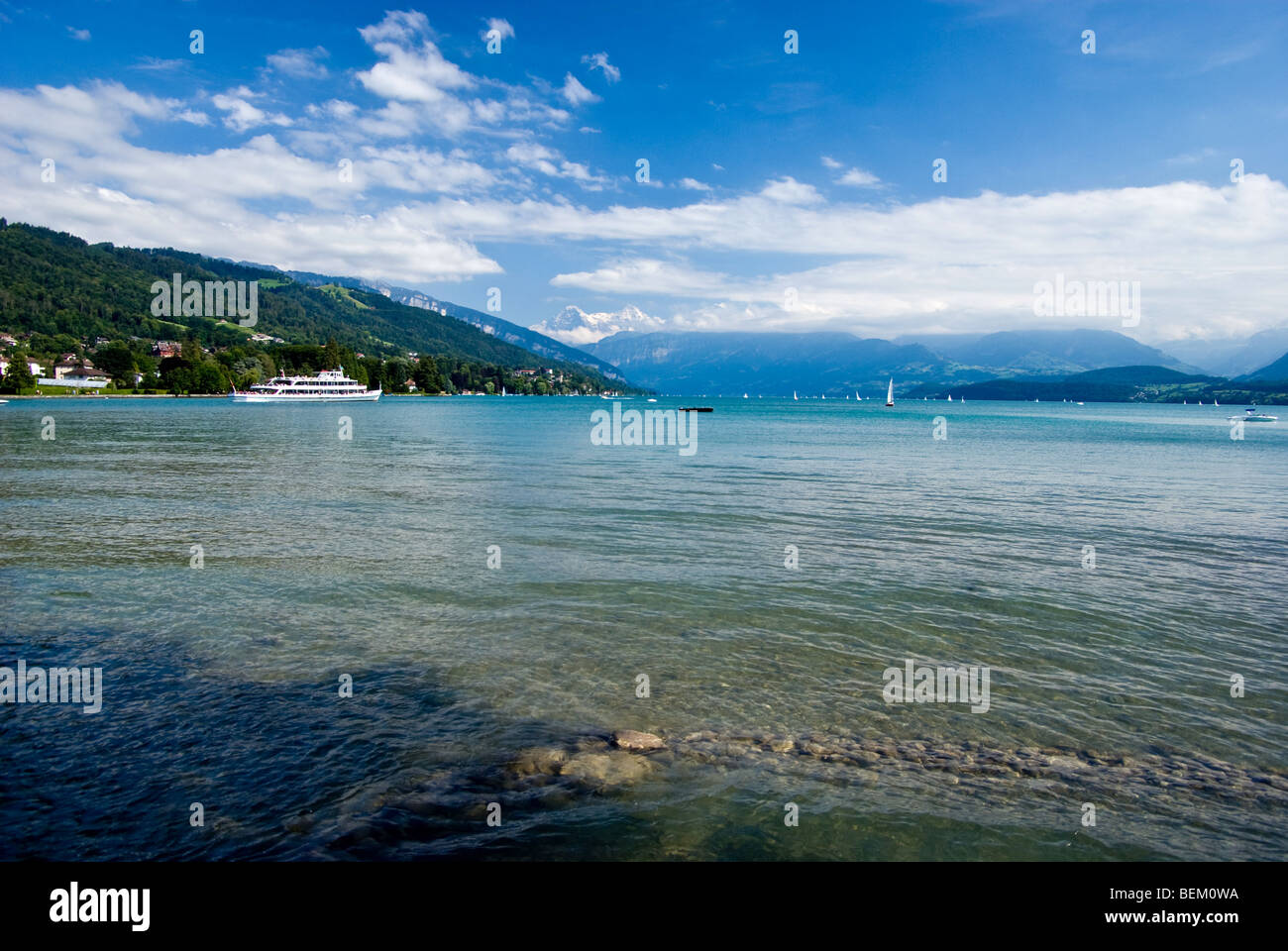 Lake Thun in the Swiss town of Thun. Alps mountains. Thunersee. Tourism ...