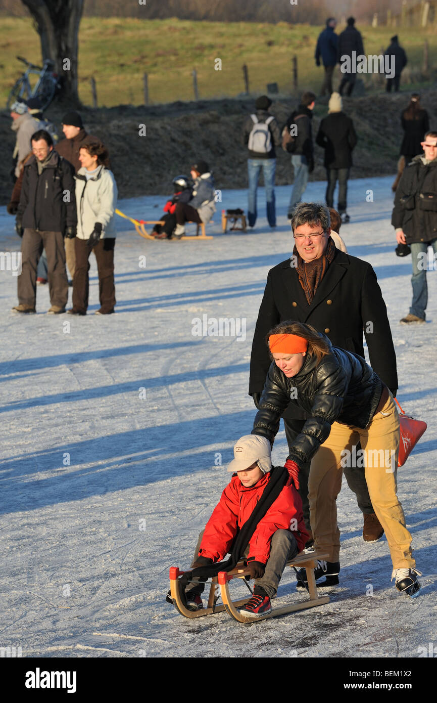 Boy pushing sled hi-res stock photography and images - Alamy