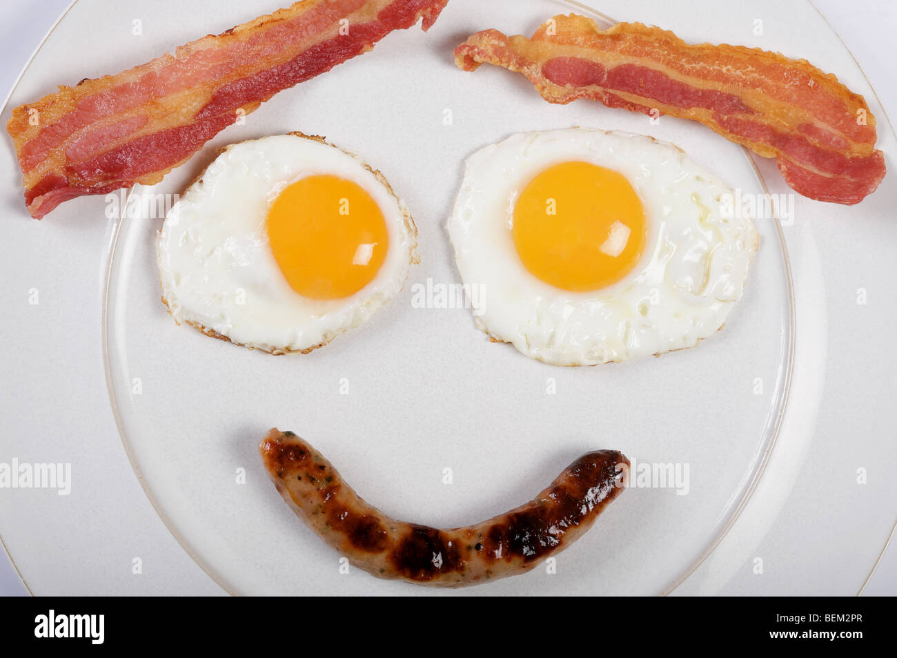 Traditional English breakfast in the shape of a face Stock Photo - Alamy