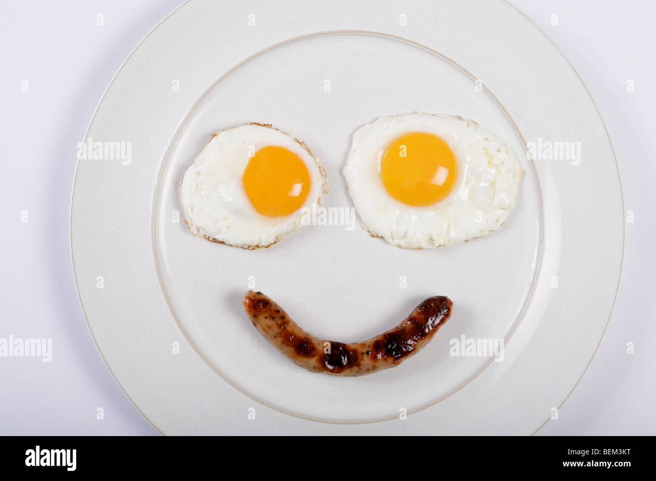 Smiling face of fried eggs and sausage Stock Photo - Alamy