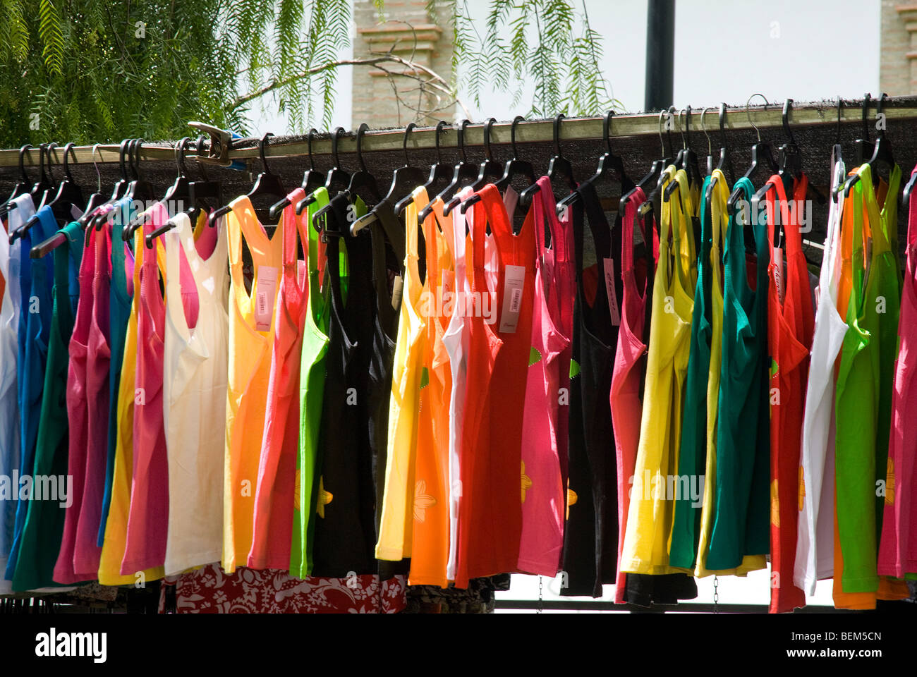 Colorful dresses on market stall in Spain Stock Photo - Alamy