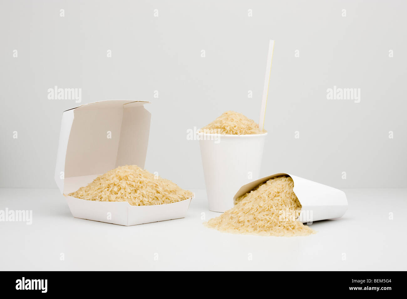 Food concept, uncooked rice inside fast food containers Stock Photo - Alamy