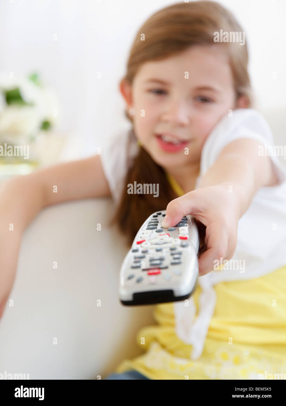 Child with TV remote Stock Photo - Alamy