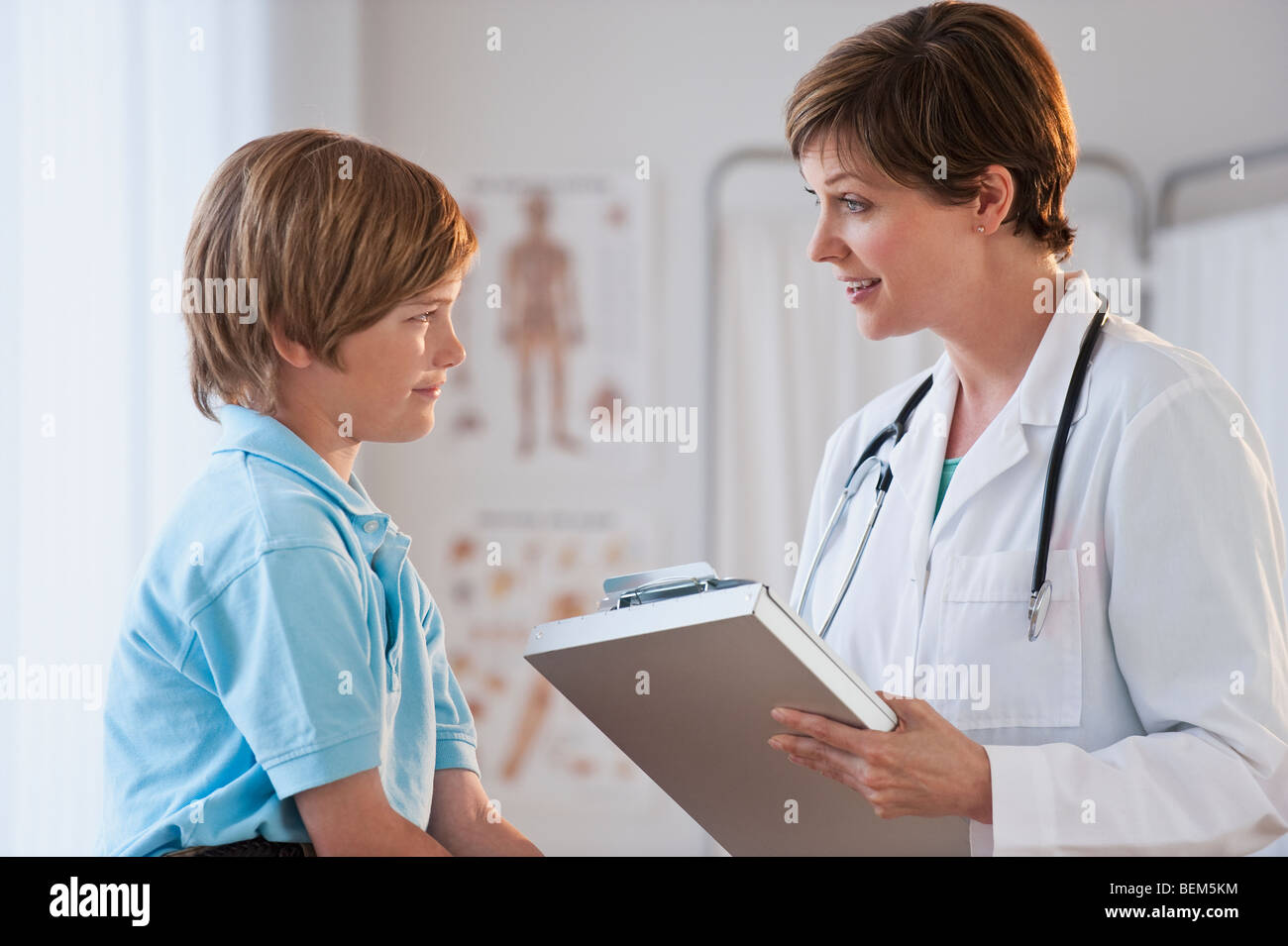 Female doctor with child Stock Photo - Alamy