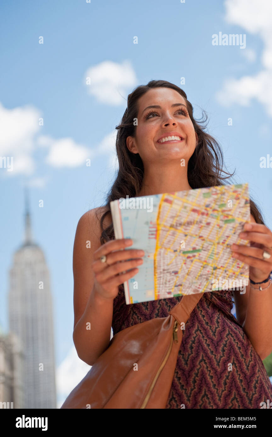 Woman with tourist map Stock Photo - Alamy