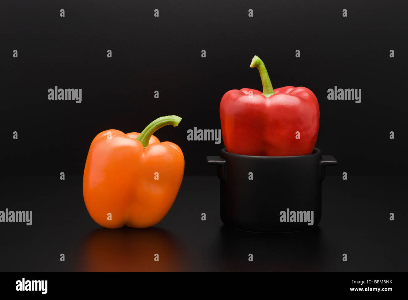 Fresh bell peppers, one in miniature pot Stock Photo - Alamy