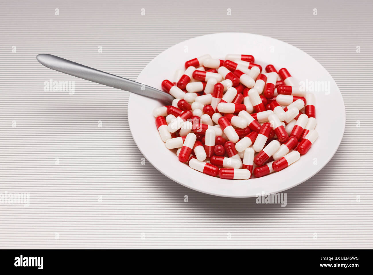 Food concept, bowl full of pills Stock Photo - Alamy