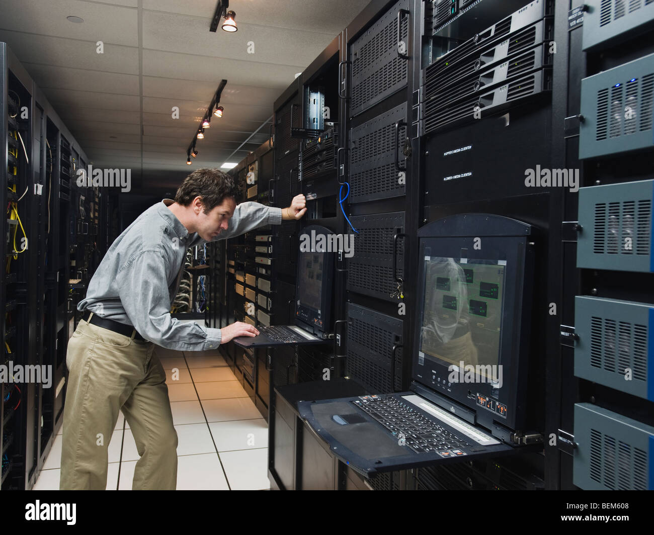 Man working in data center Stock Photo - Alamy