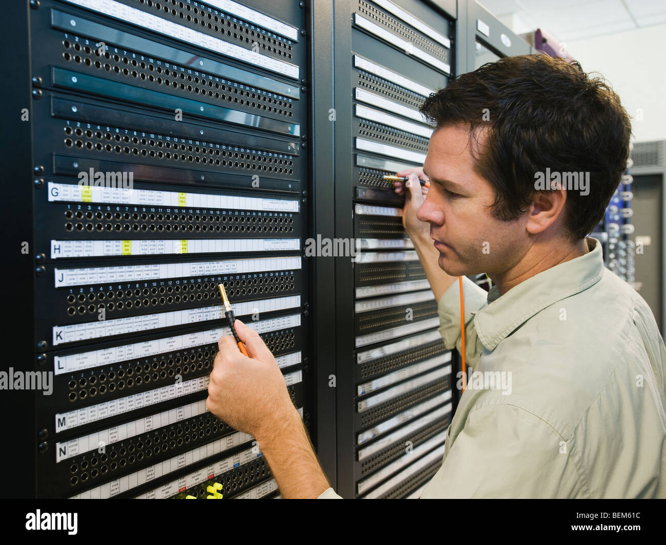 Man working in data center Stock Photo - Alamy