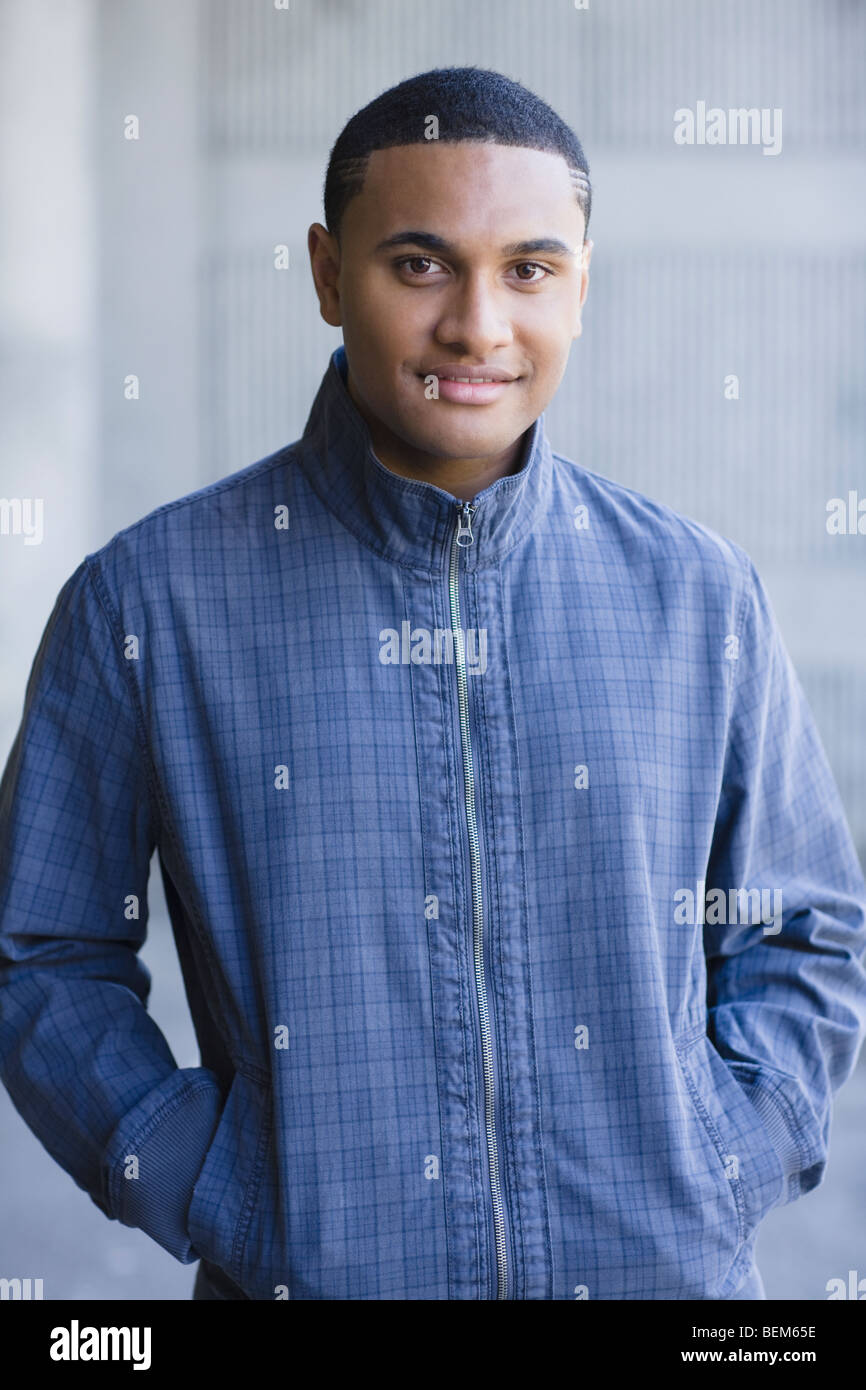Young man looking at camera Stock Photo - Alamy