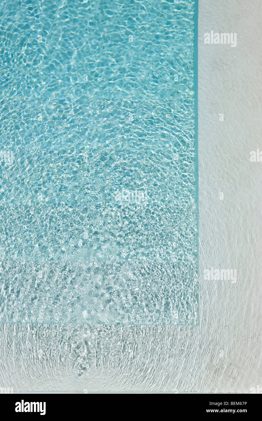Sunlight refracted on water in swimming pool Stock Photo - Alamy