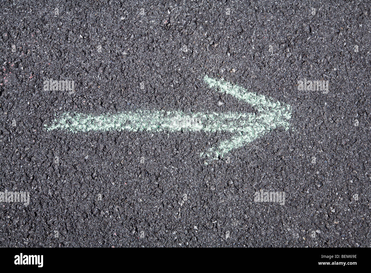 Arrow pointing right on pavement Stock Photo - Alamy