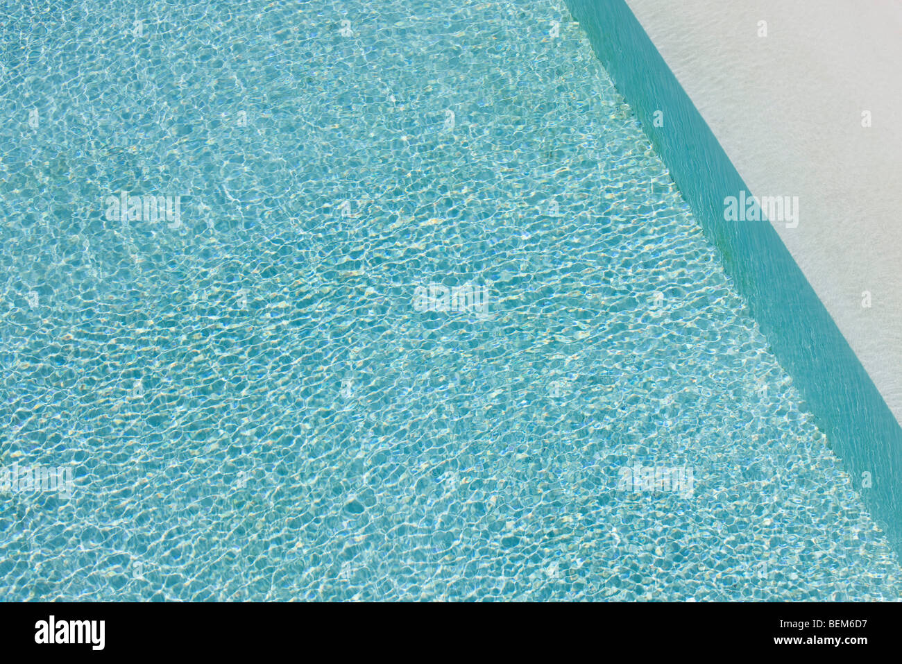 Sunlight refracted on water in swimming pool Stock Photo - Alamy