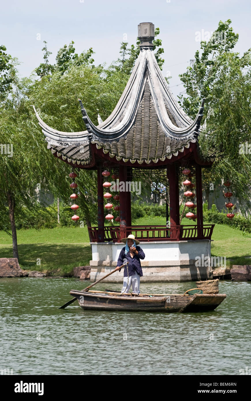 Traditional boat long the river in front of pagoda. Xitang is an ...