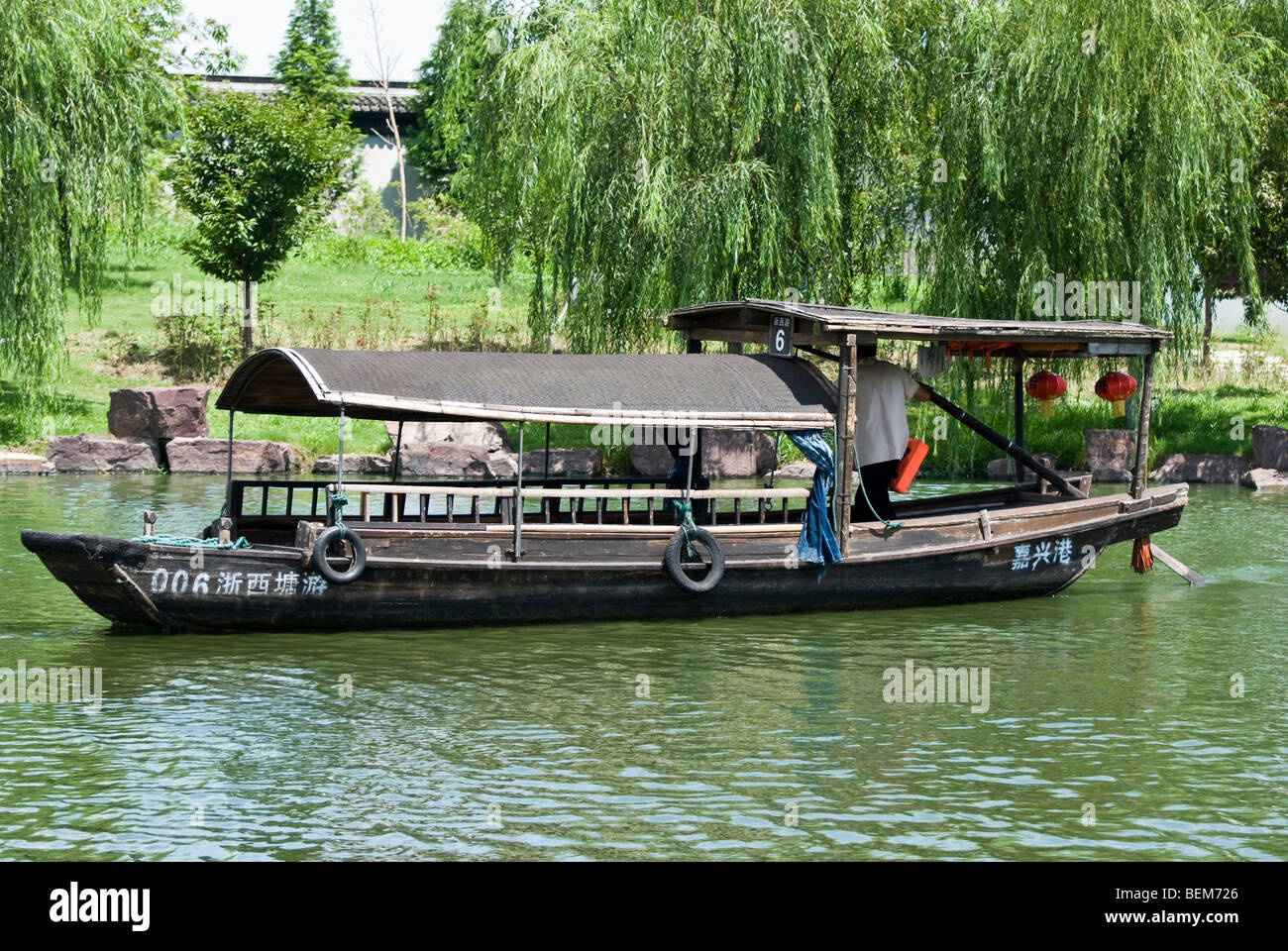 Traditional ancient style boat long the river. Xitang is an ancient ...
