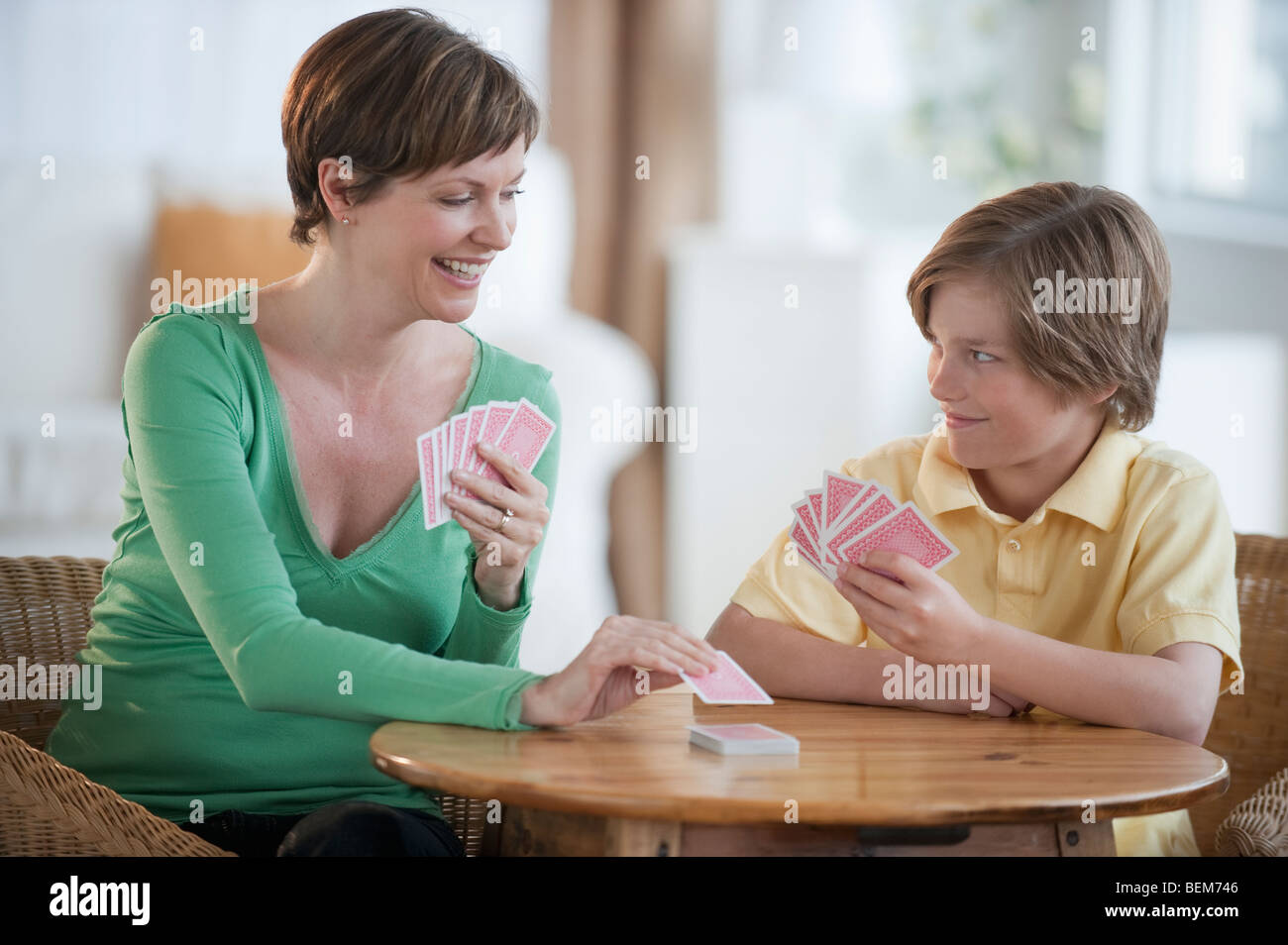 Mother and son playing cards Stock Photo - Alamy