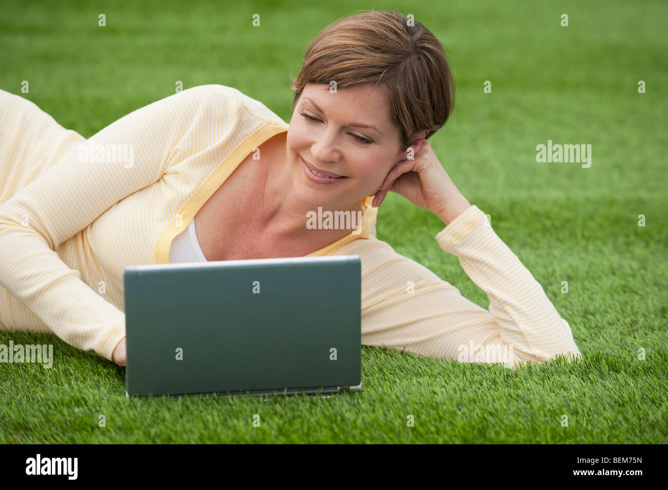 Woman on laptop Stock Photo - Alamy