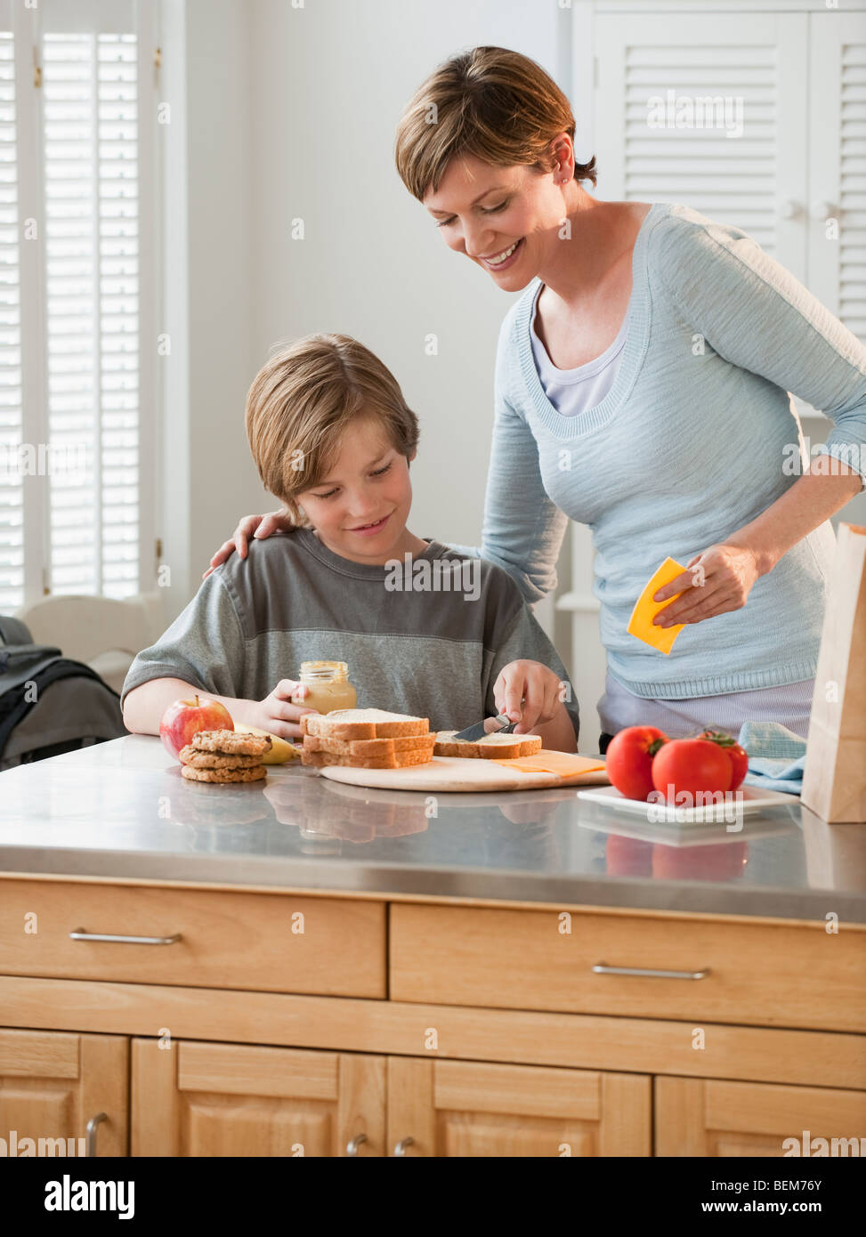Mother and child preparing food Stock Photo - Alamy
