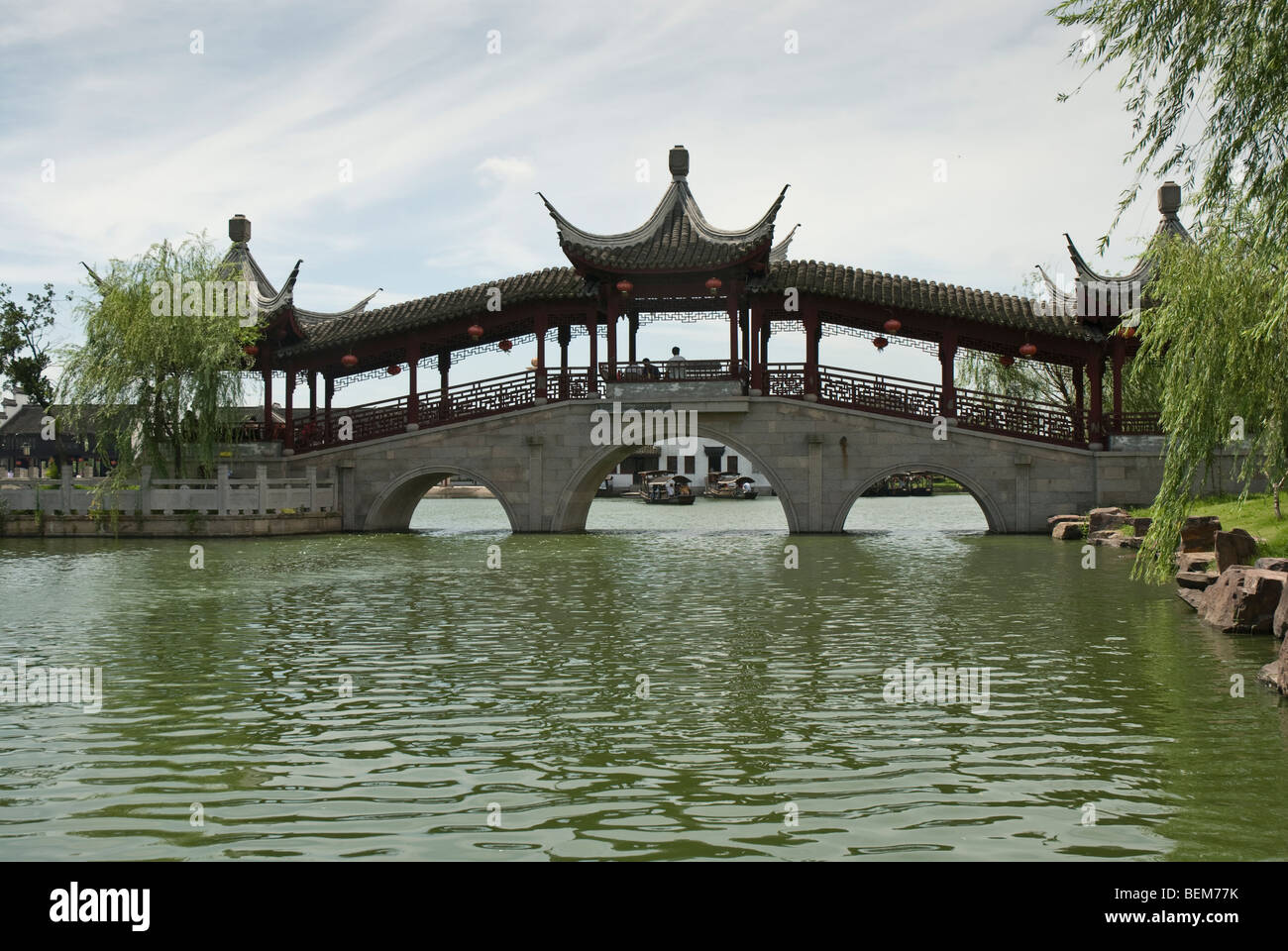 Stone bridge with wooden portico crossing canal Xitang is an ancient ...