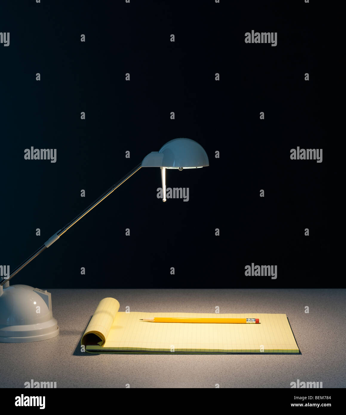 Light and pad of paper Stock Photo - Alamy