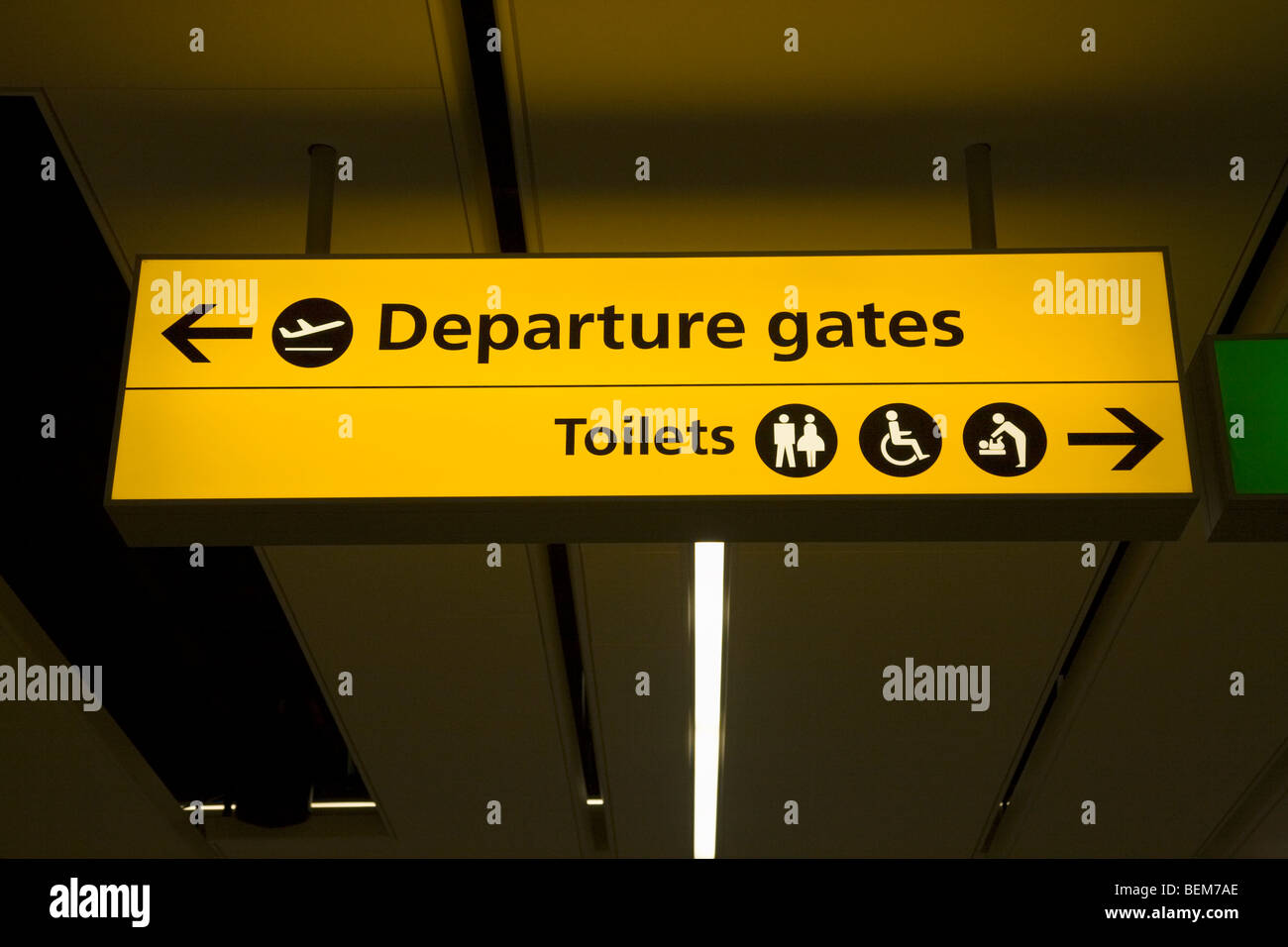 Sign to the departure gates, and to the toilets, in the departure ...