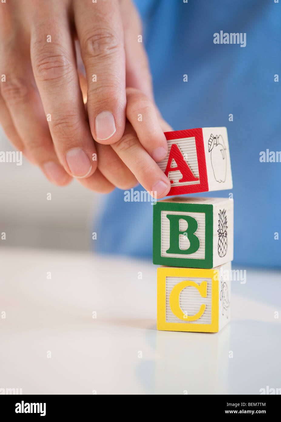 Child playing with ABC blocks Stock Photo - Alamy