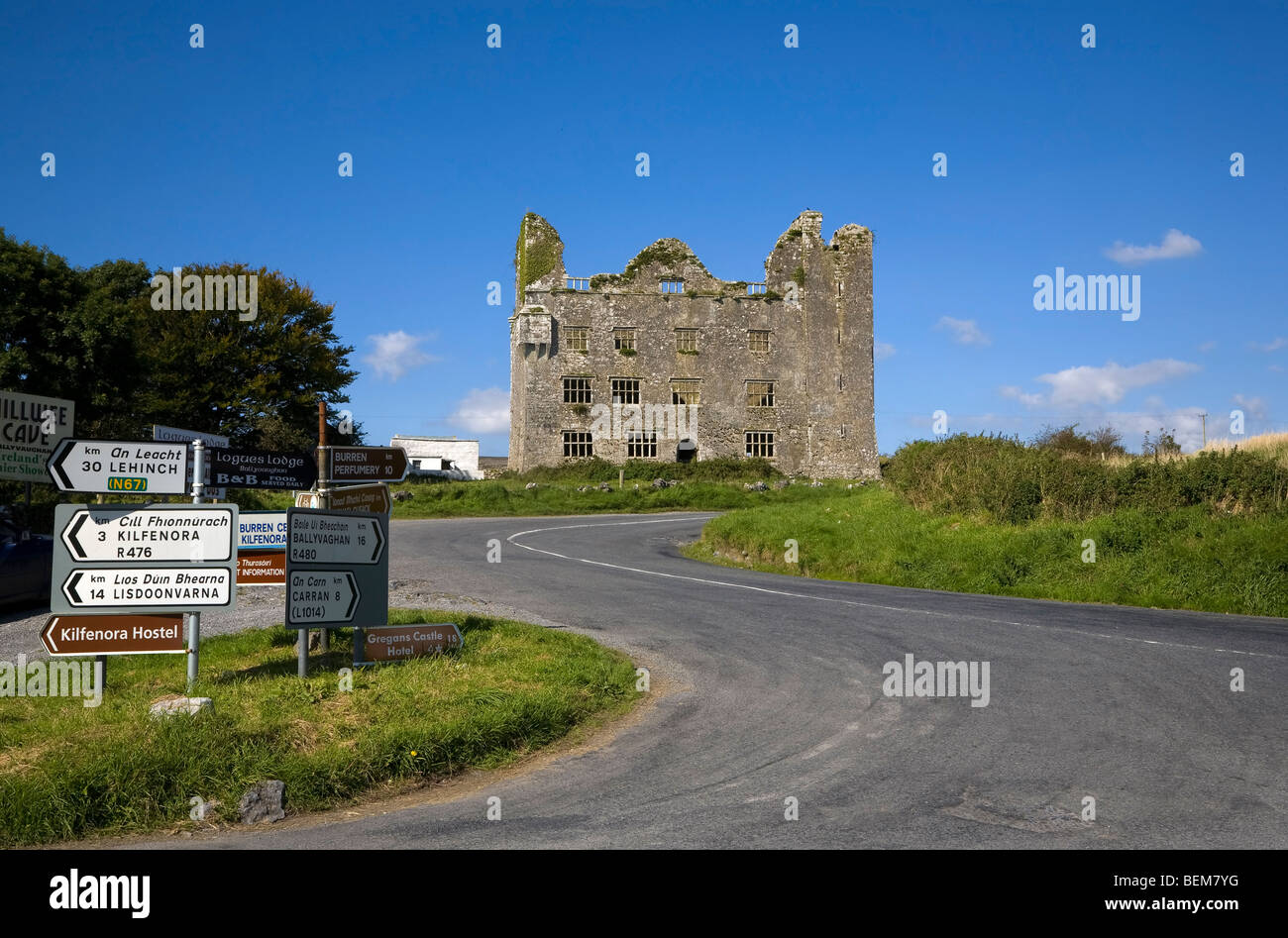 Road Signs by 15th Century Leamanagh Castle, The Burren, County Clare ...
