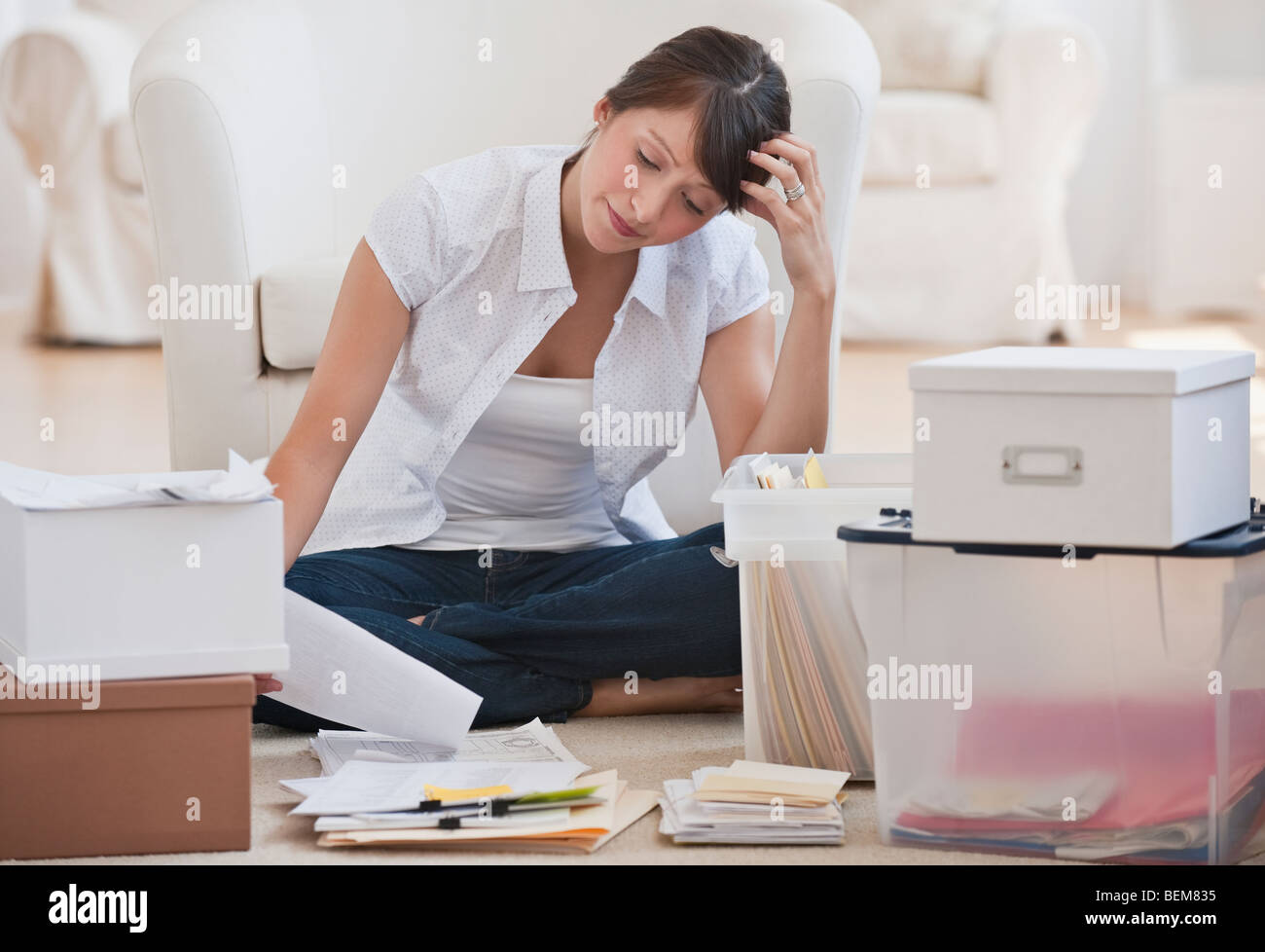 Woman organizing papers Stock Photo - Alamy