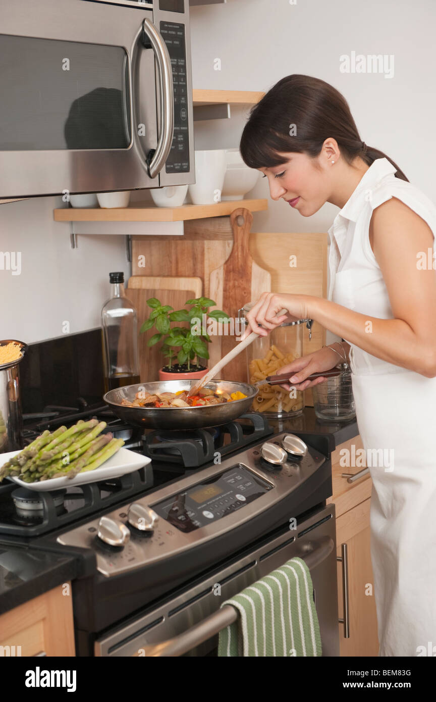 Woman gas cooking hi-res stock photography and images - Alamy