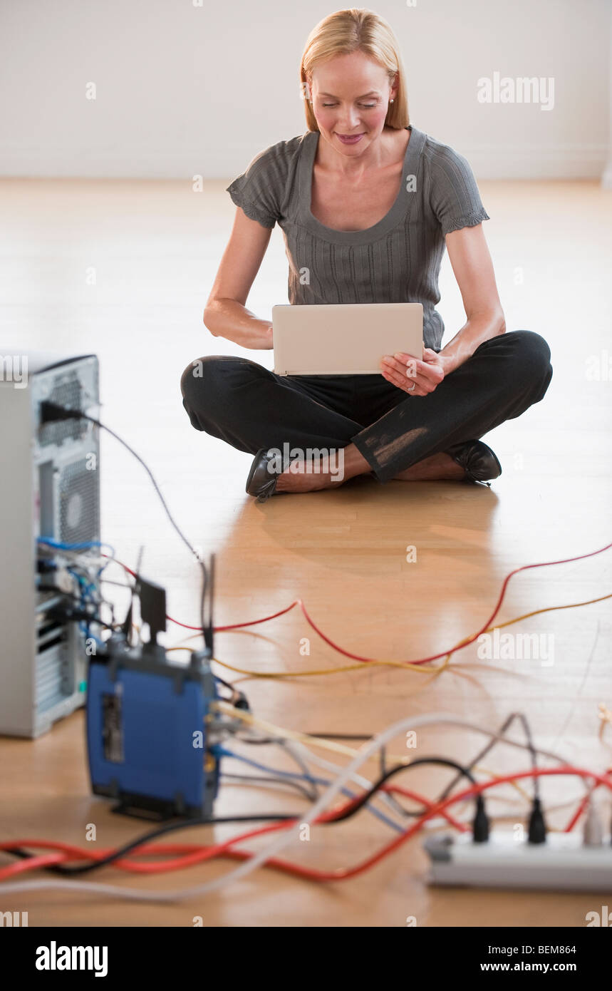 Women sitting while working on computer Stock Photo - Alamy