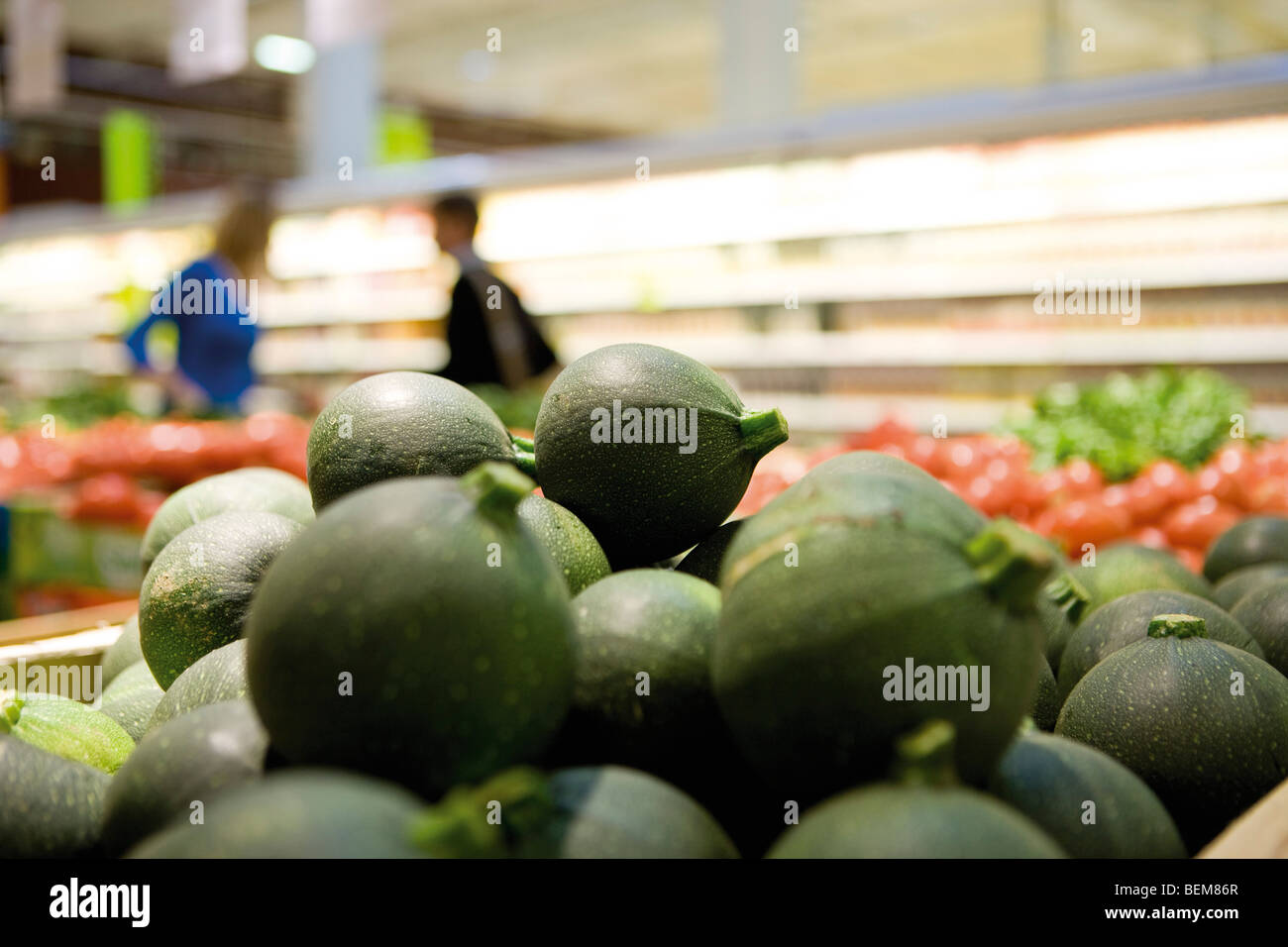 Globe zucchini display in supermarket produce section Stock Photo - Alamy