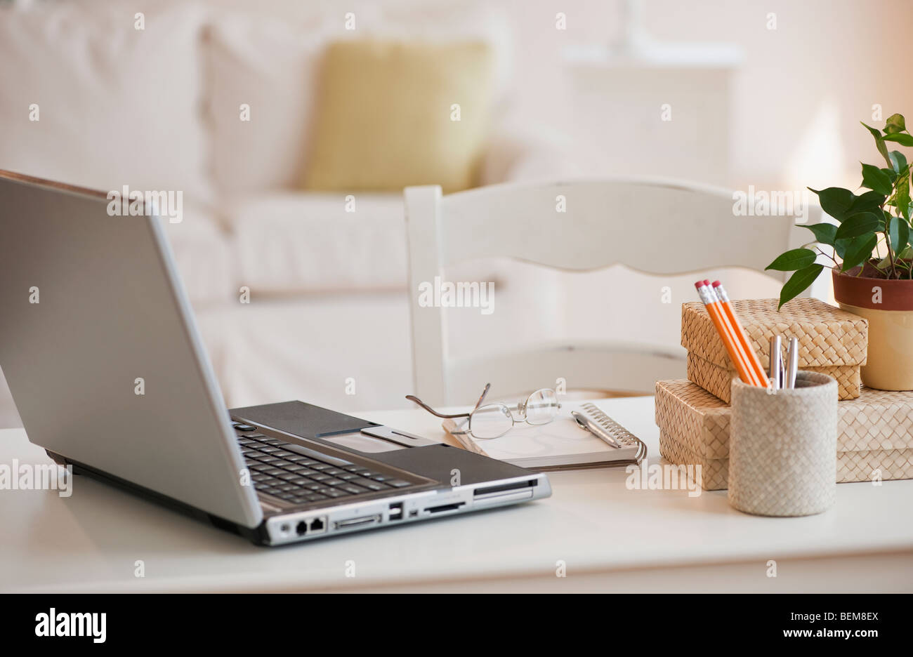 Laptop on table Stock Photo - Alamy