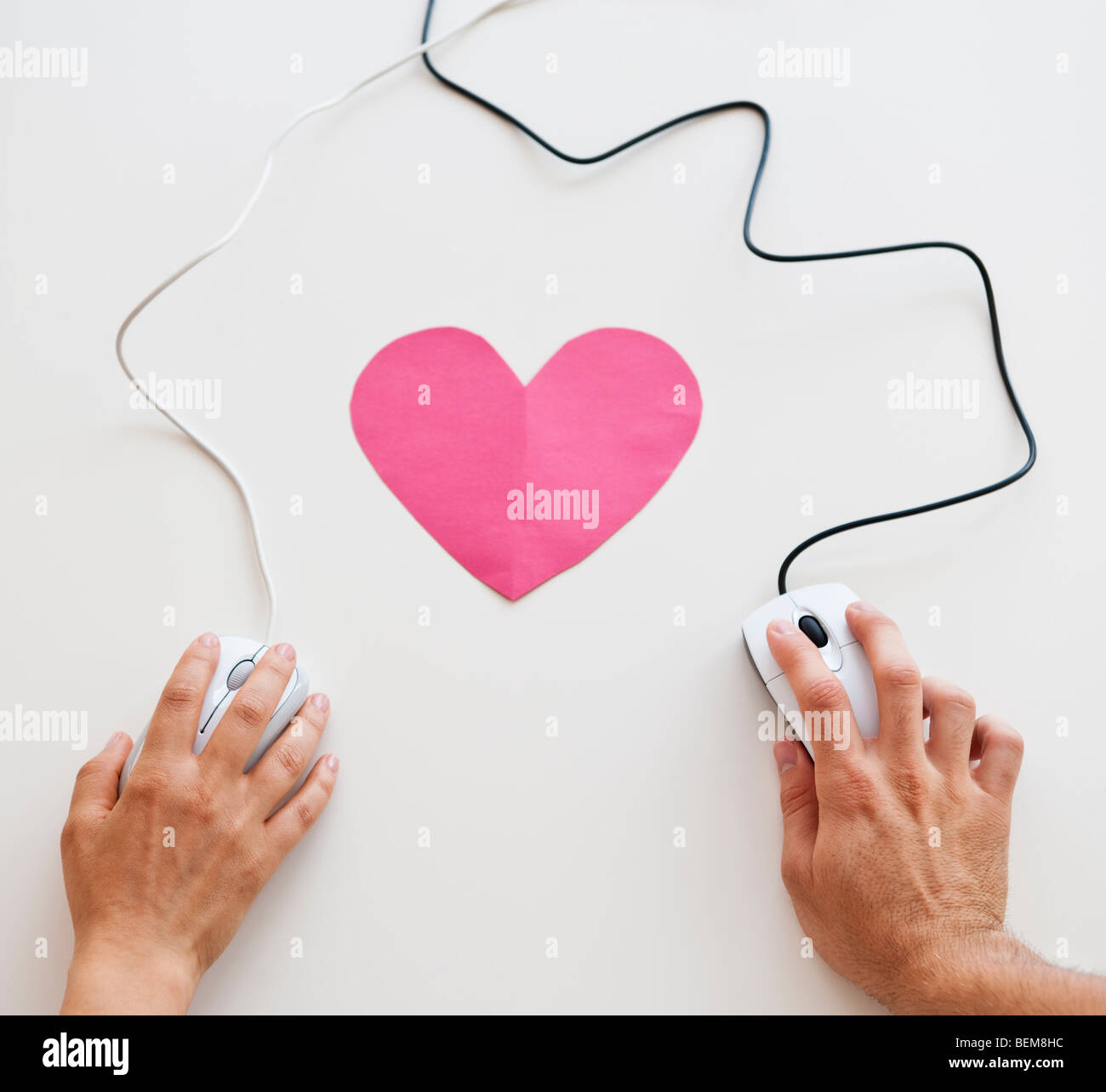 Two computer mice with heart Stock Photo - Alamy