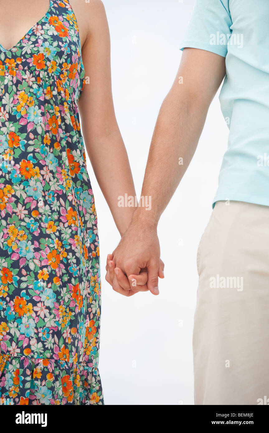 Couple holding hands Stock Photo - Alamy
