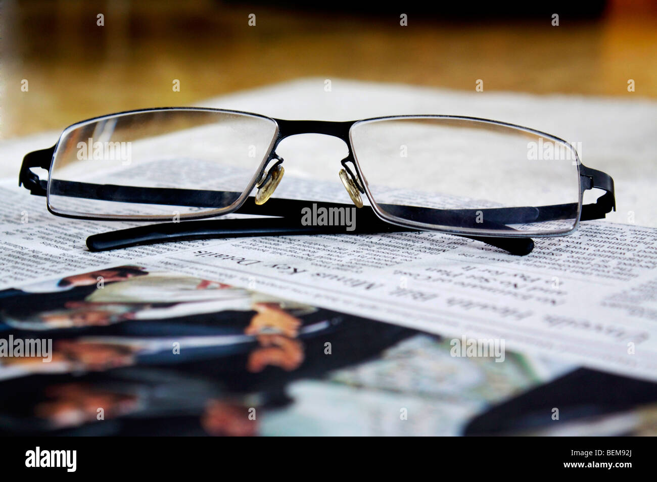 Glasses and newspaper Stock Photo - Alamy
