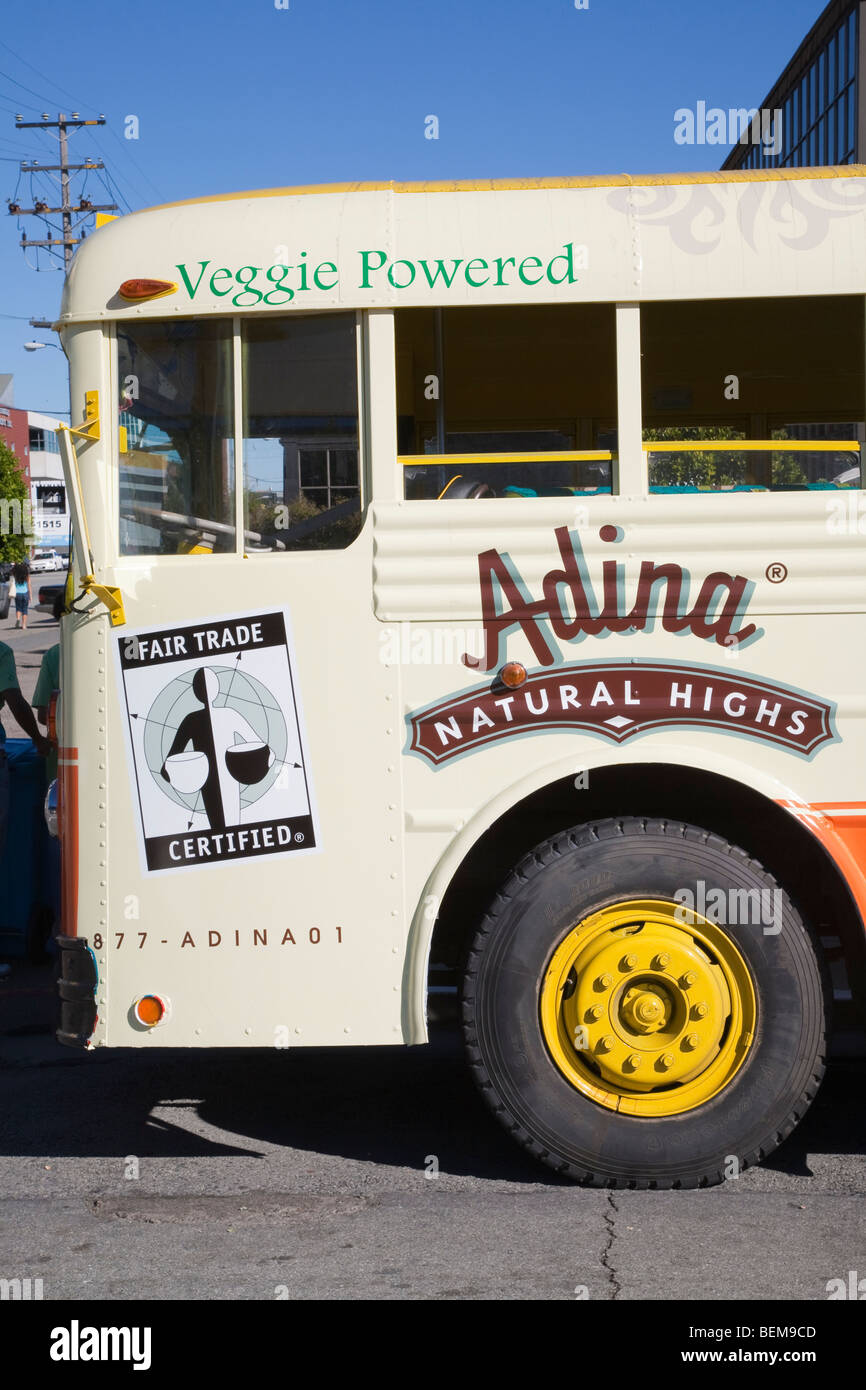 A close up of a vegetable oil powered tour bus outside the Green ...