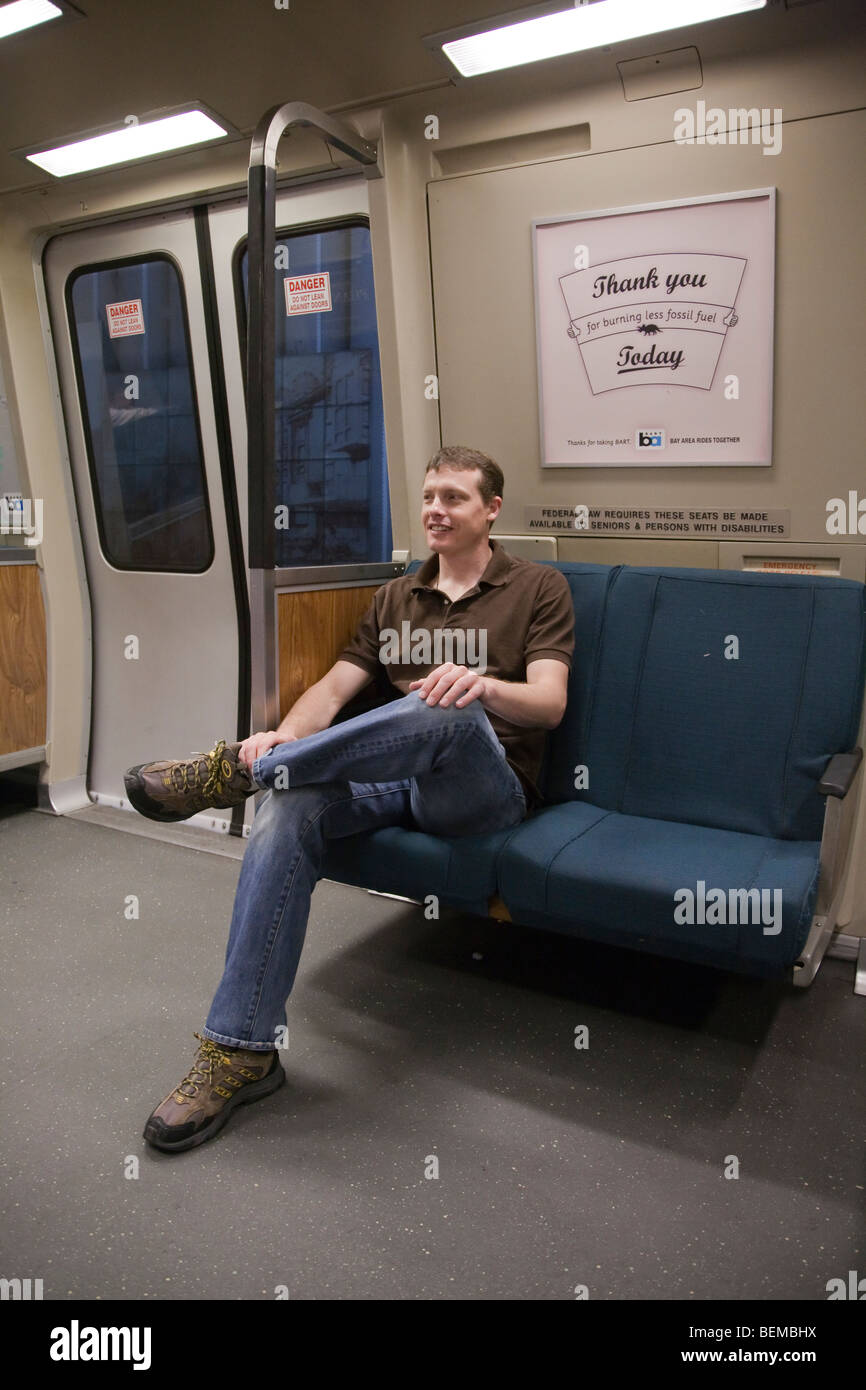 A mid adult man enjoying a ride on BART train. California, USA Stock ...