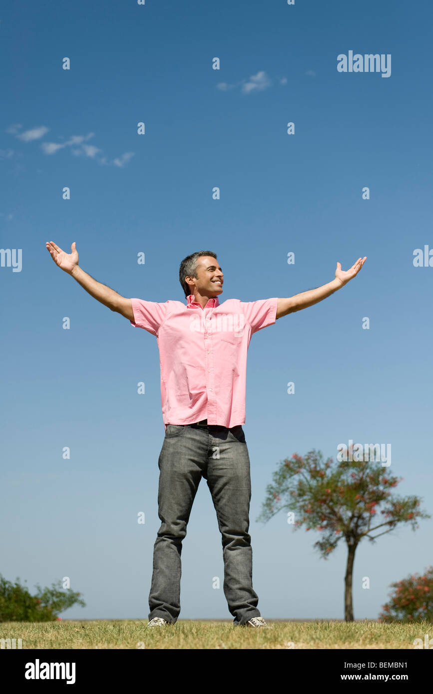 Male Standing With Arms Out