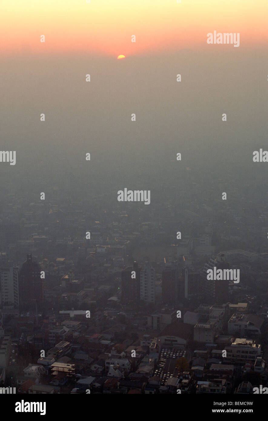 Aerial view of smog at sunset over west Shinjuku district, Tokyo, Japan ...