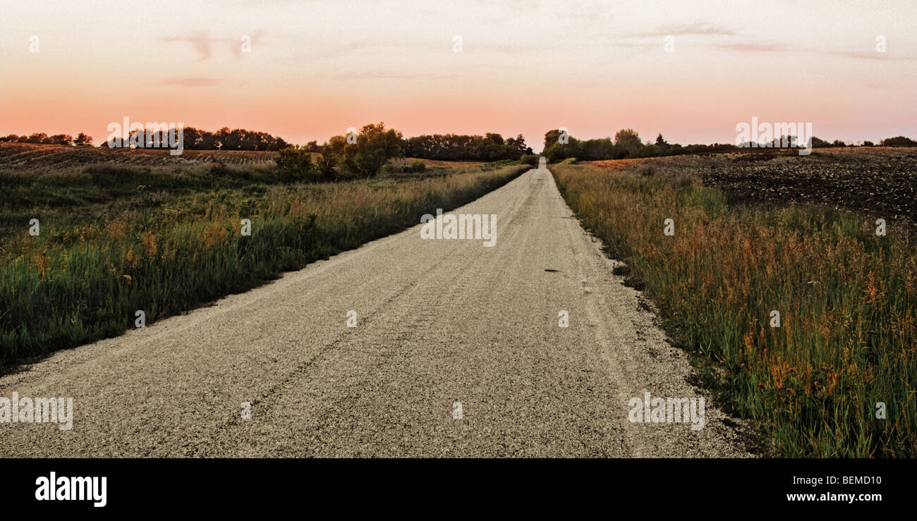 Country road at sunset Stock Photo - Alamy