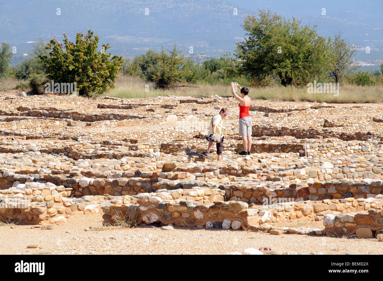 Tourist photographing at Olynthos ancient Greek city archaeological ...