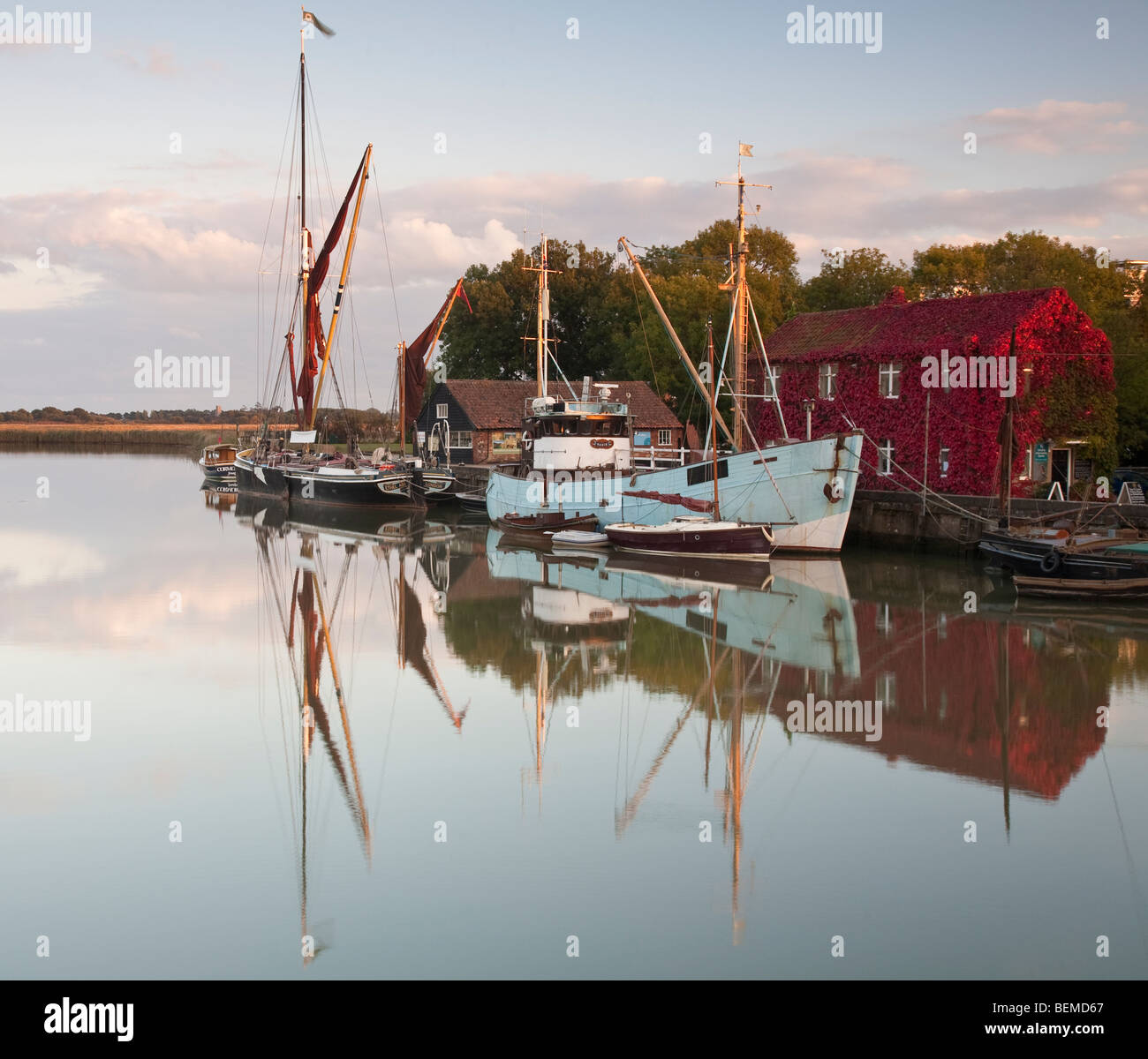 Old sailing vessels moored on the river Alde at Snape Maltings Suffolk ...