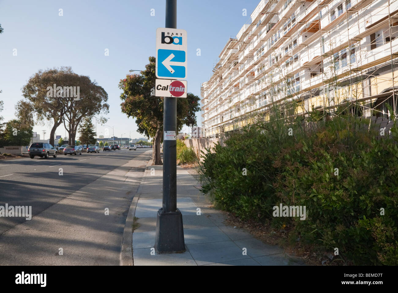 BART and Caltrain road signs near a transit oriented condo development ...