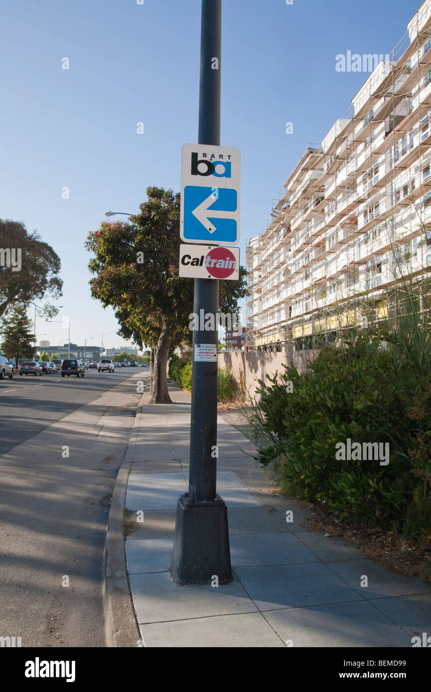 BART and Caltrain road signs near a transit oriented condo development ...