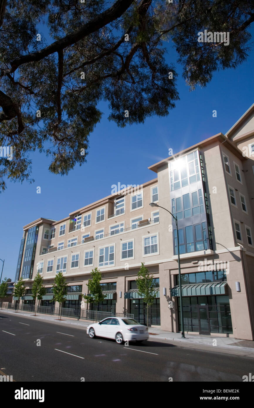 A tilted view of a building with condos and office space, viewed from a ...