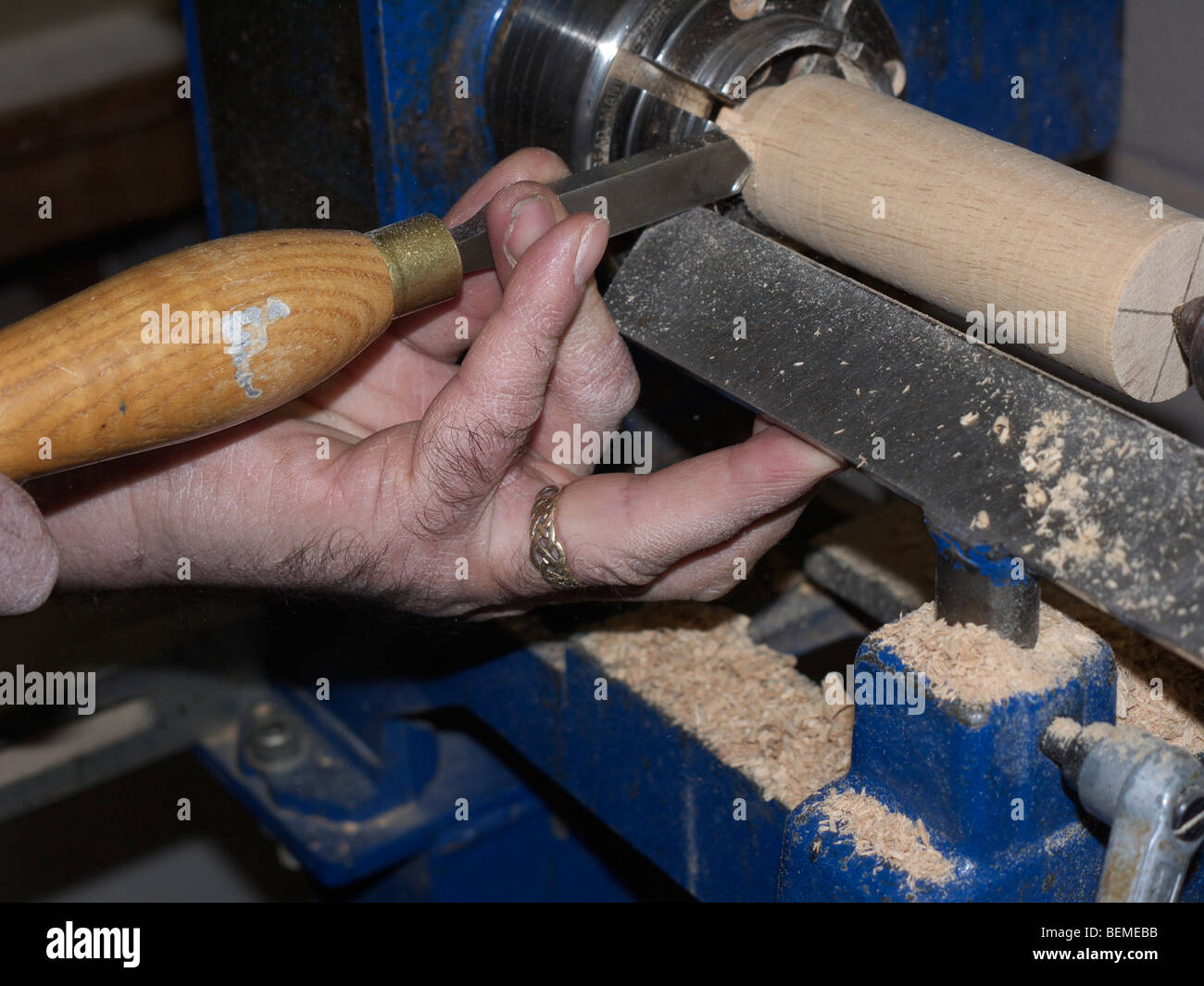 Craftsman working turning wood on lather Stock Photo - Alamy