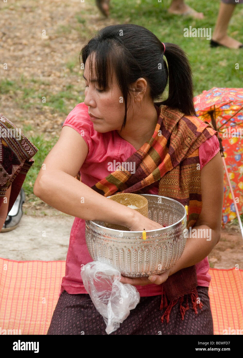 Woman giving offerings hi-res stock photography and images - Alamy