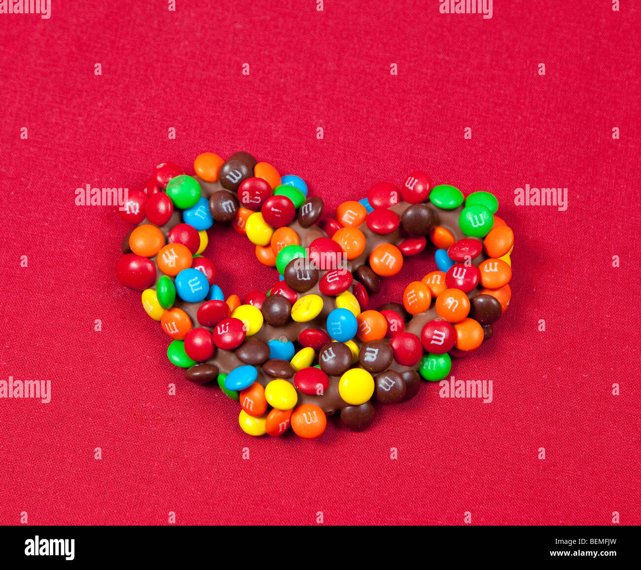 A chocolate covered pretzel coated with mini m&ms. A trick or treat ...